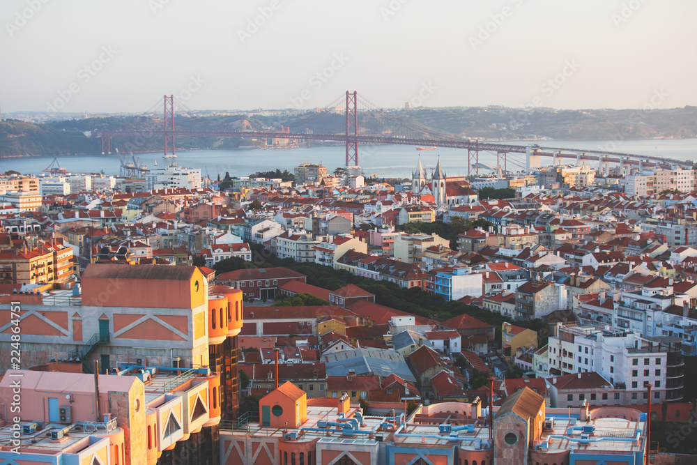 Beautiful super wide-angle aerial view of Lisbon, Portugal with harbor, skyline, scenery beyond ...