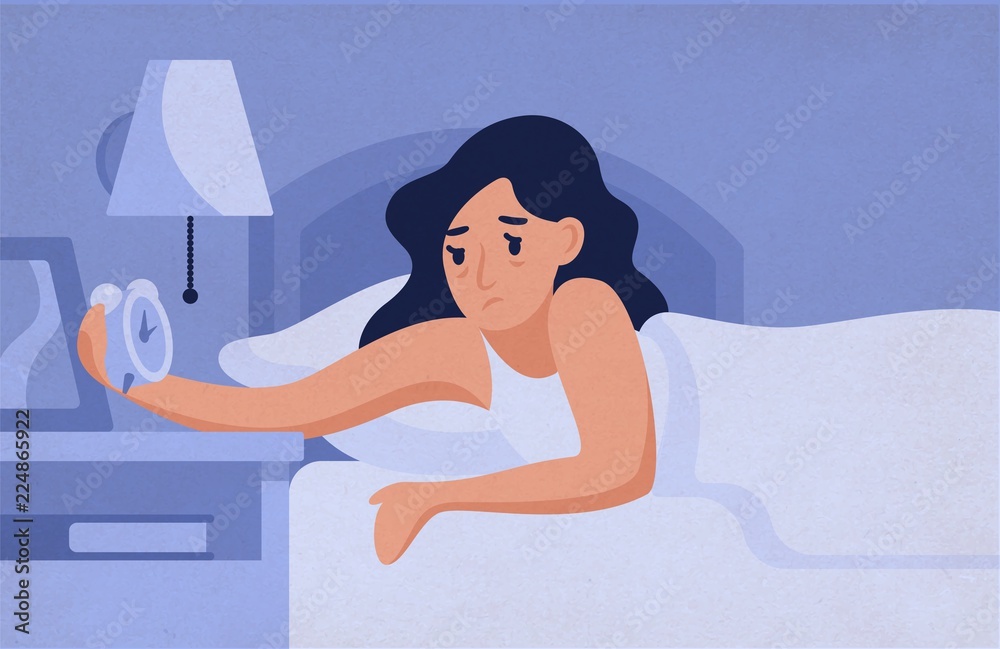 Sleepy woman lying on bed and looking at alarm clock at night. Female ...
