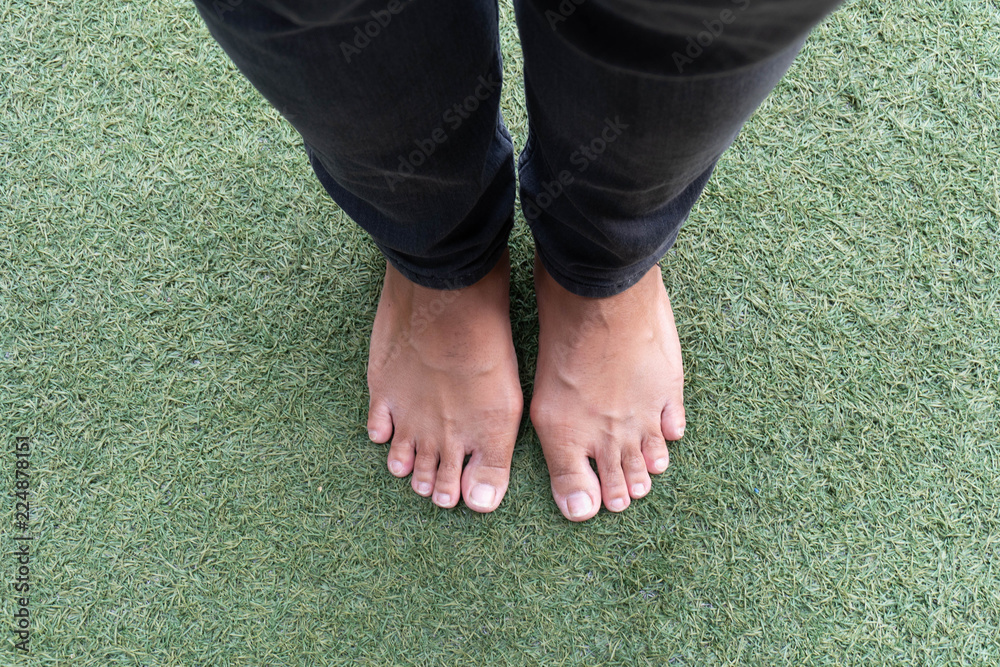 Fat woman's bare feet on the grass Stock Photo | Adobe Stock