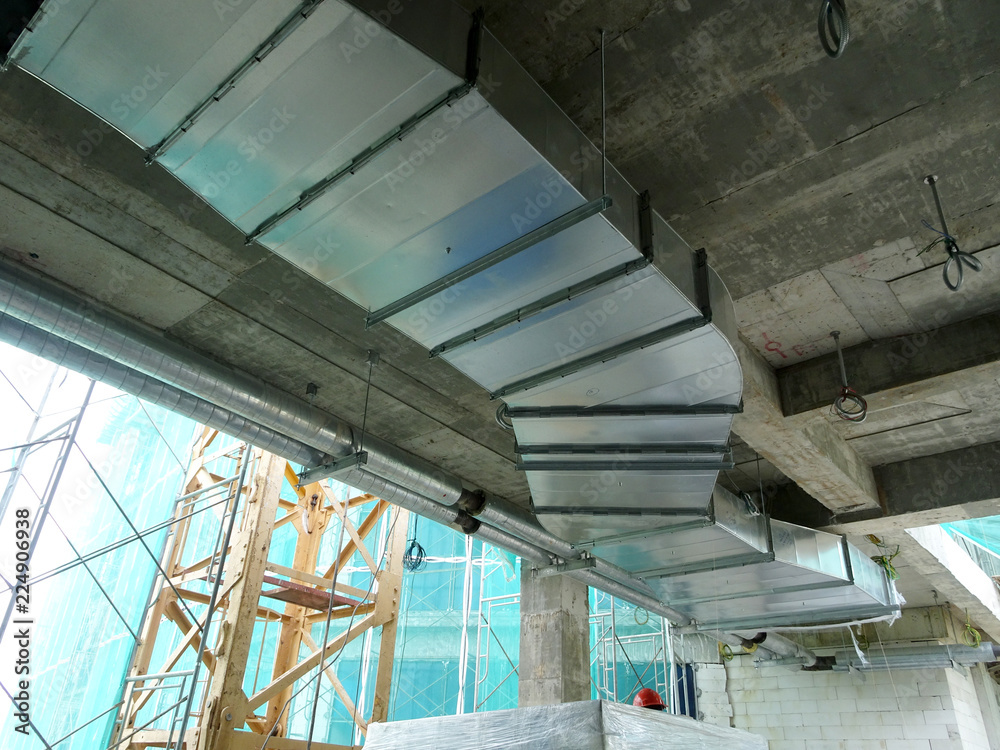 Air-condition and ventilation duct installed by construction workers at ...