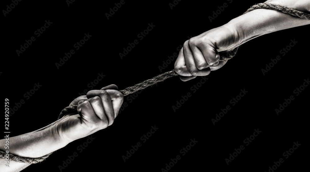Hand holding a rope, climbing rope, strength and determination. Two ...