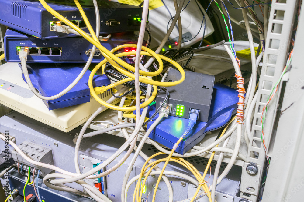 Server cabinet with network Internet equipment. Chaotic interlacing of ...