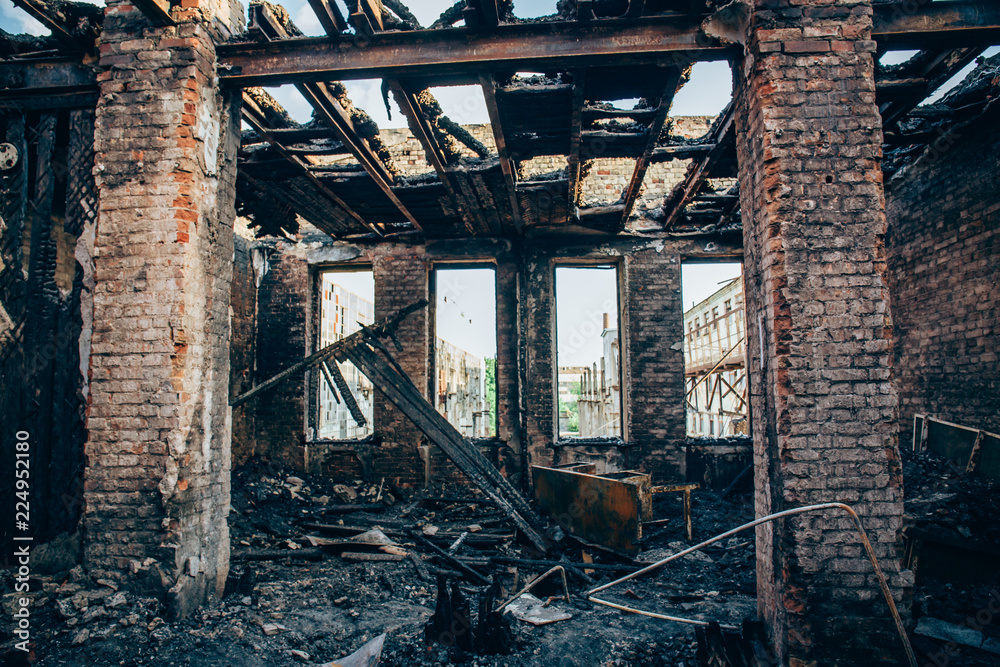 Burnt room interior with walls, furniture and floor in ash and coal ...