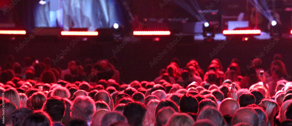 heads of people during live outdoor concert with many lights on Stock ...