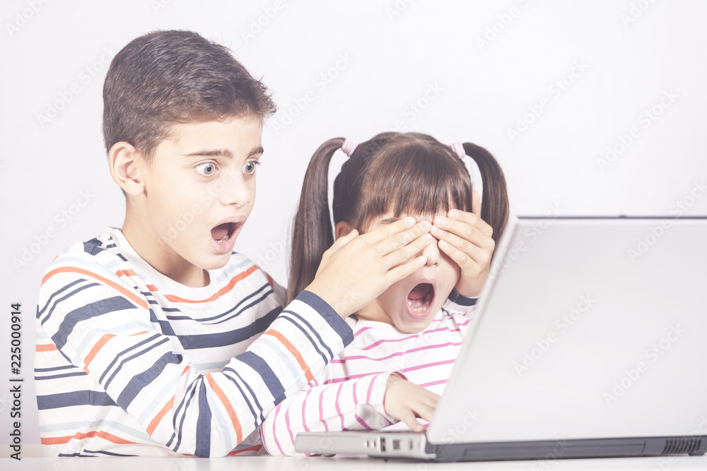 Stockfoto Little boy protects his sister from watching inappropriate ...