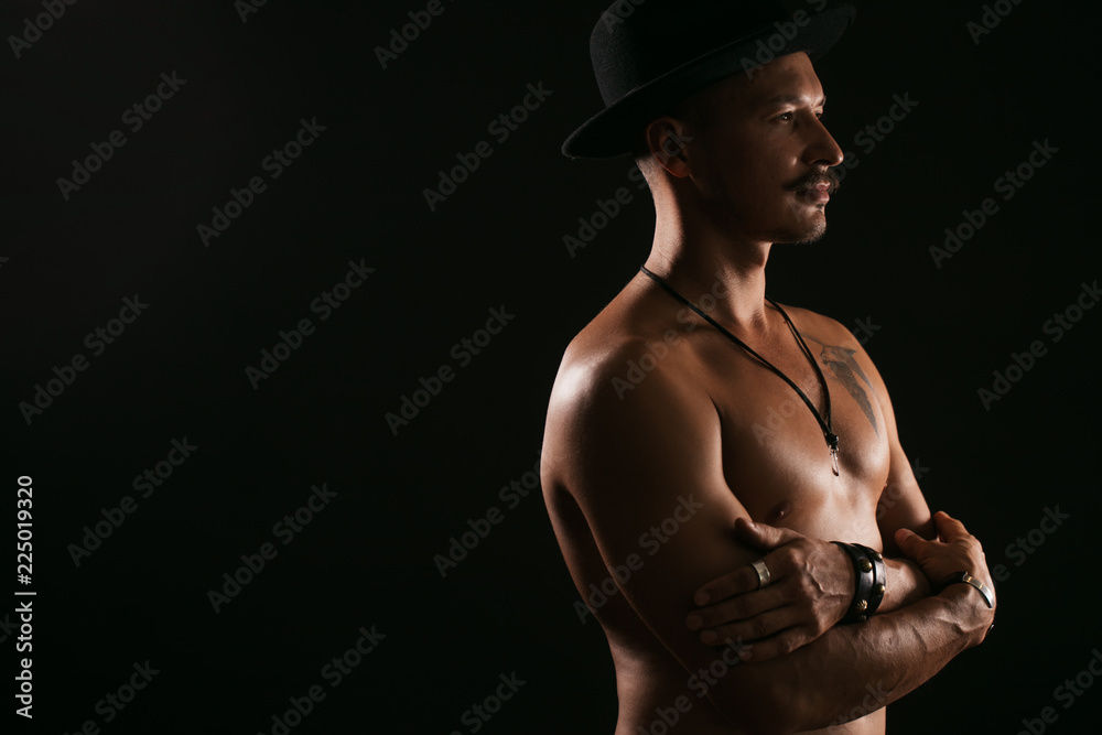 Half size studio portrait of handsome shirtless muscular man with ...