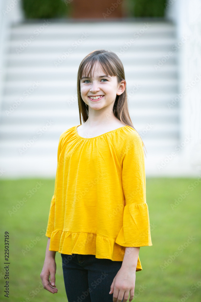 Tween Girl in Yellow Gold Outside Her Home and Stairs Stock Photo ...