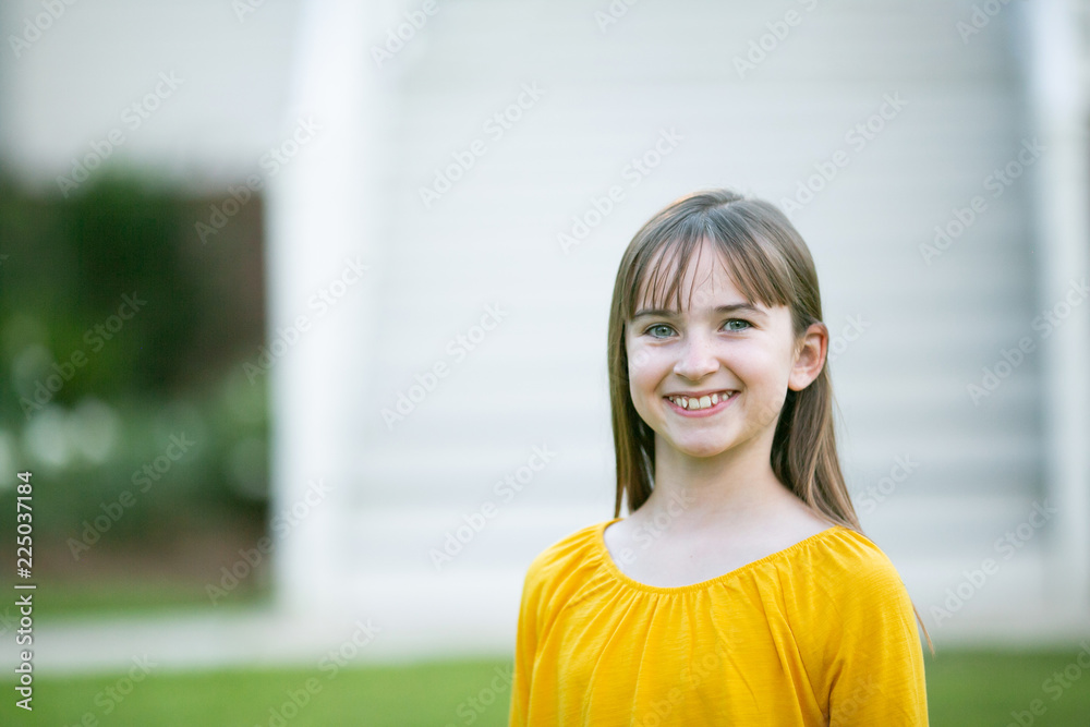 Tween Girl in Yellow Gold Outside Her Home and Stairs Stock Photo ...