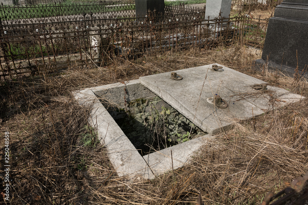 Cemetery with open grave, grave robbery Stock Photo | Adobe Stock
