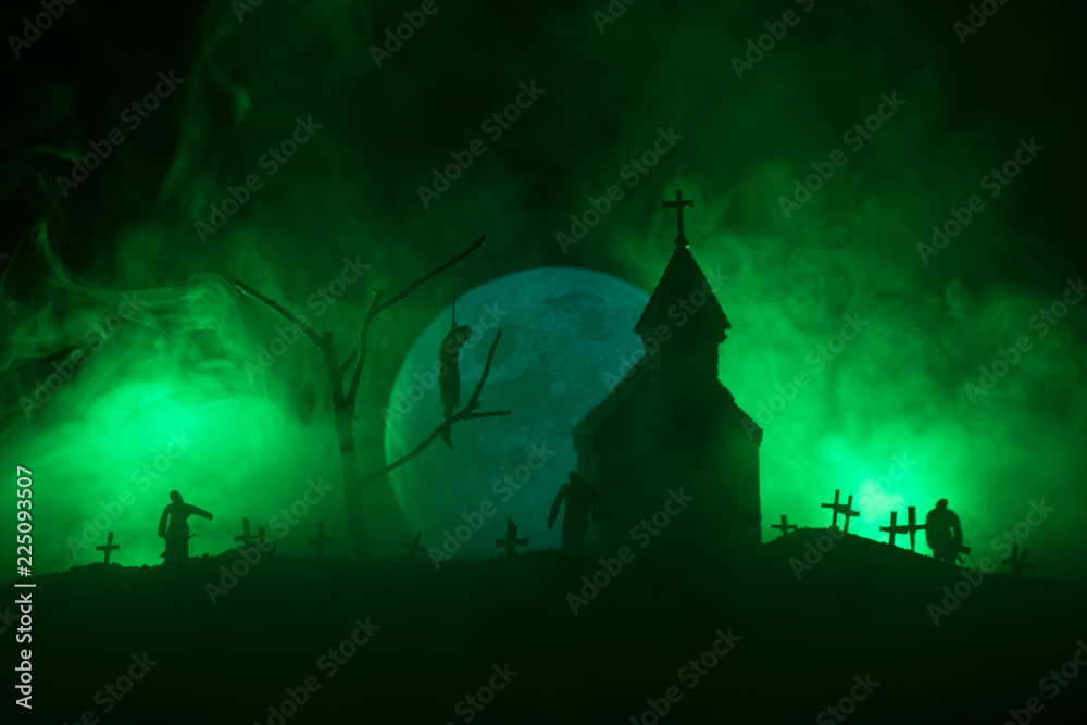 Foto de Scary view of zombies at cemetery dead tree, moon, church and ...