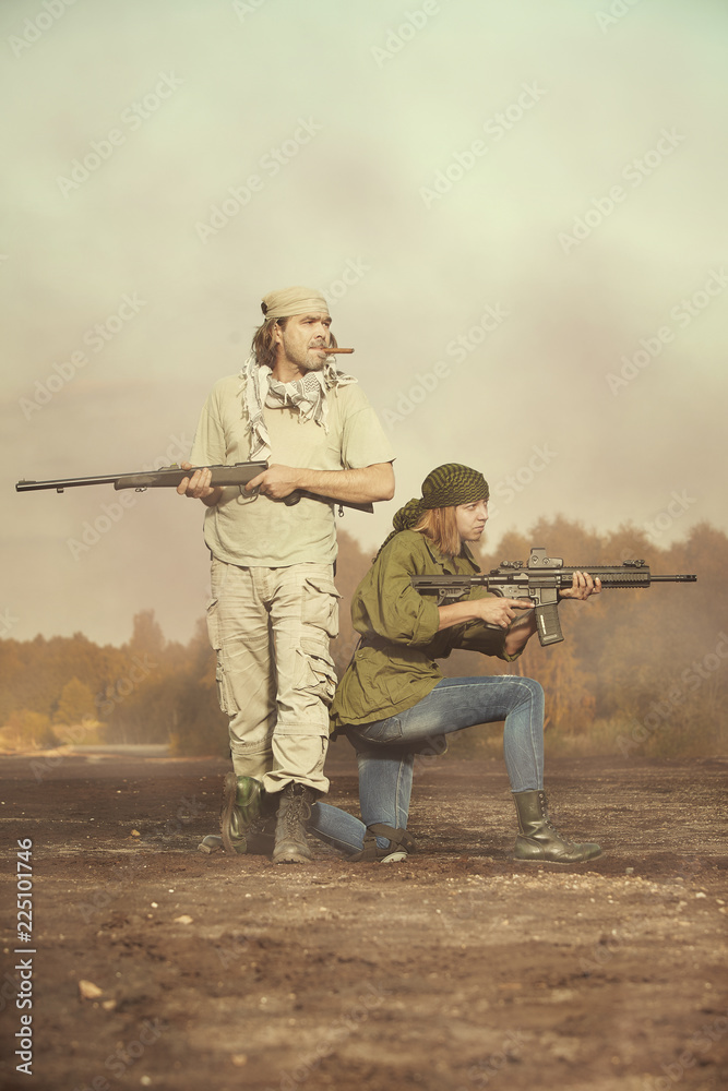 Guerilla, partisan or territory army couple watching around armed with ...