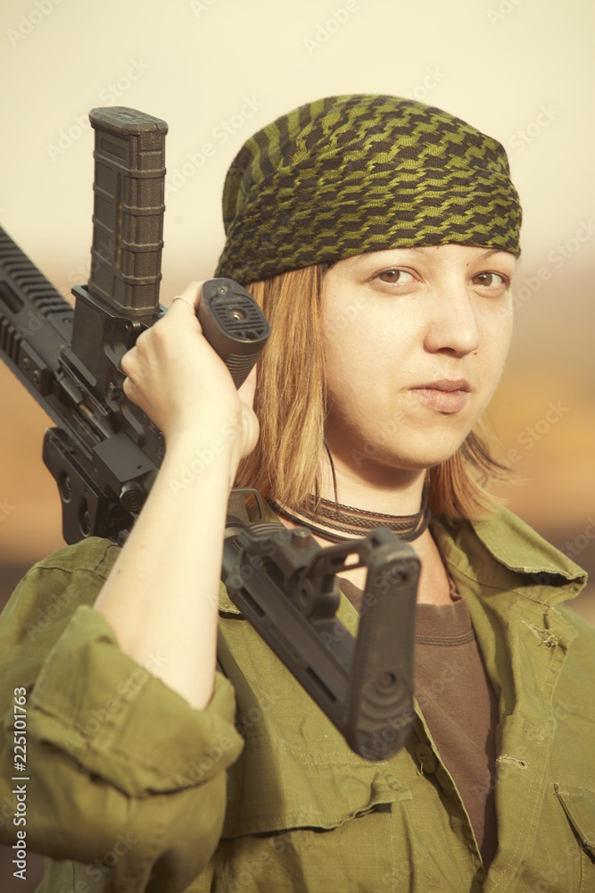 Guerilla, partisan or territory army lady watching around armed with ...