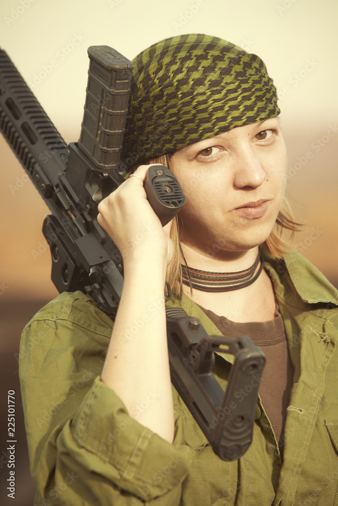 Guerilla, partisan or territory army lady watching around armed with ...