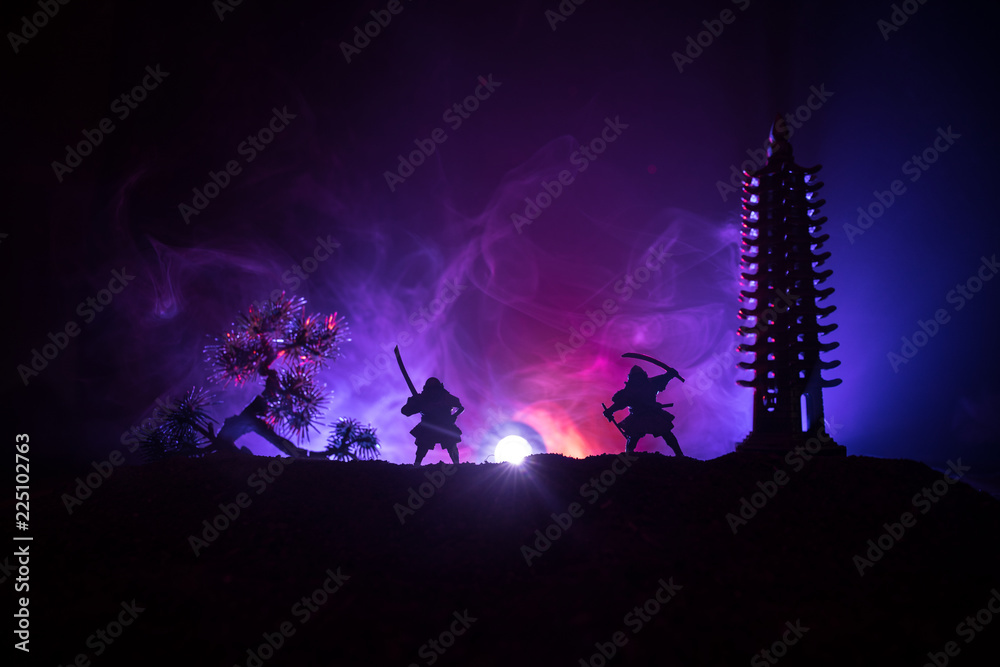 Samurai fighting concept. Silhouette of samurais in duel near tree and ...