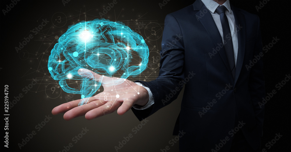 Businessman holding human brain on his hand with logistics symbols ...