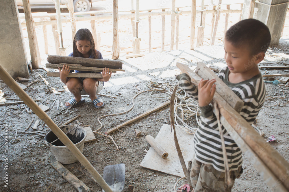 Poor children working at construction site against children labour ...