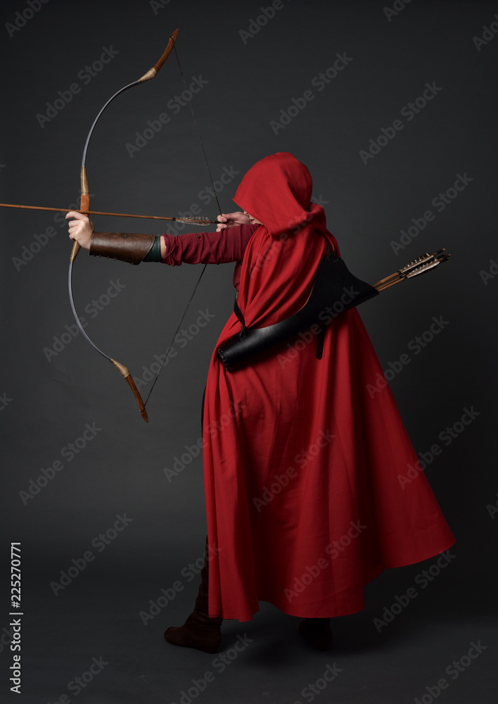 full length portrait of brunette girl wearing red medieval costume and ...