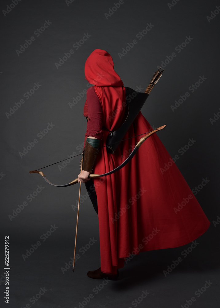full length portrait of brunette girl wearing red medieval costume and ...