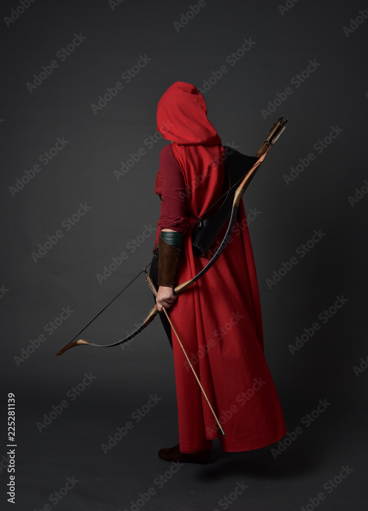 full length portrait of brunette girl wearing red medieval costume and ...