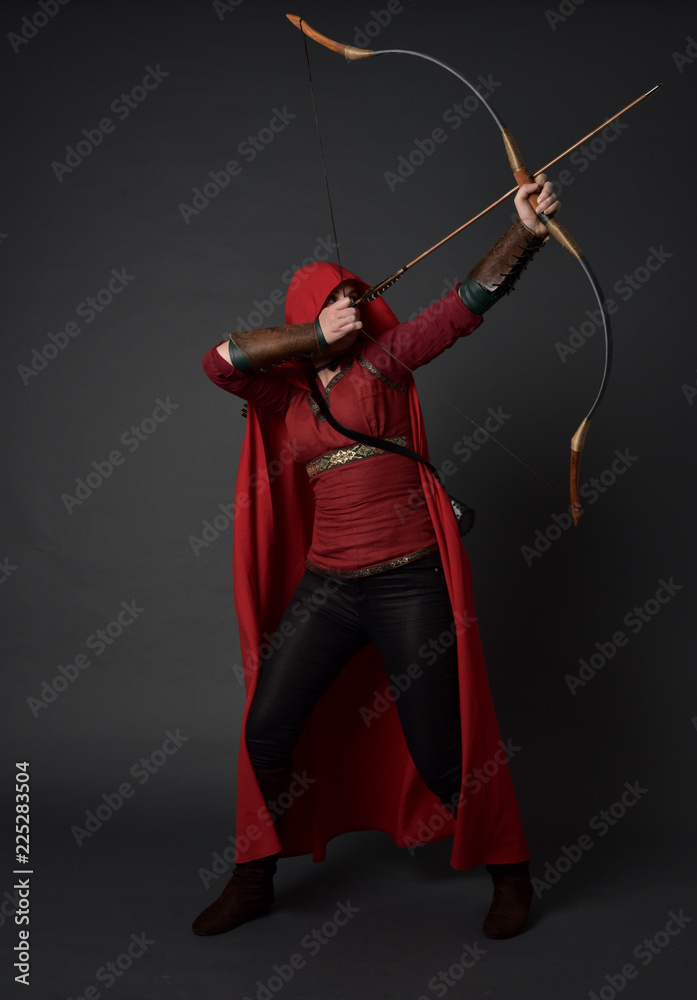 full length portrait of brunette girl wearing red medieval costume and ...