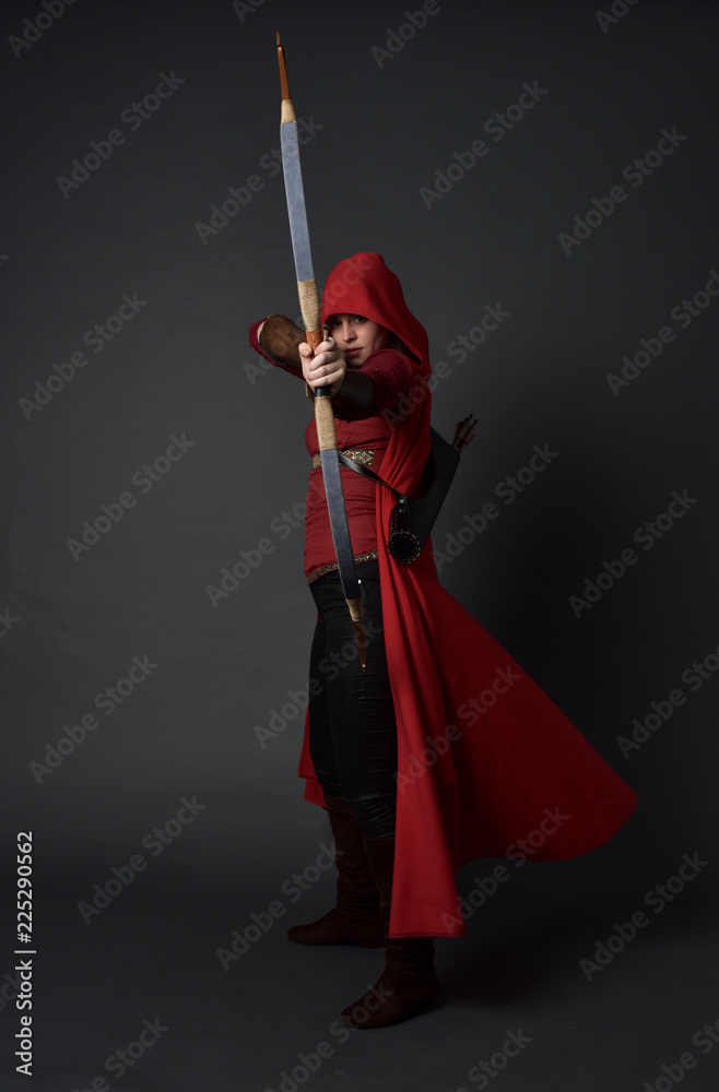 full length portrait of brunette girl wearing red medieval costume and ...