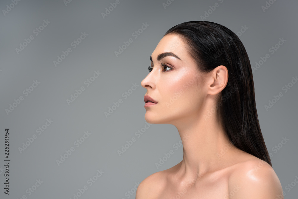 profile of beautiful young naked brunette woman looking away isolated on grey Stock Photo ...