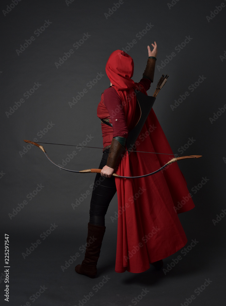 full length portrait of brunette girl wearing red medieval costume and ...