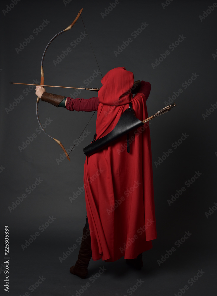 full length portrait of brunette girl wearing red medieval costume and ...