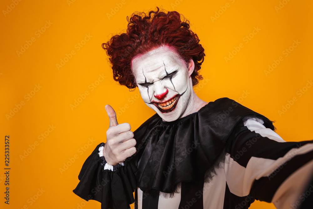 Angry smiling clown looking camera and making selfie Stock Photo ...