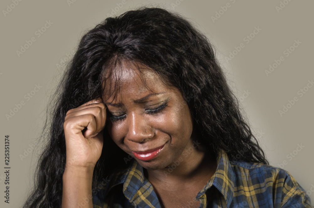 young sad and depressed black African American woman crying anxious and ...