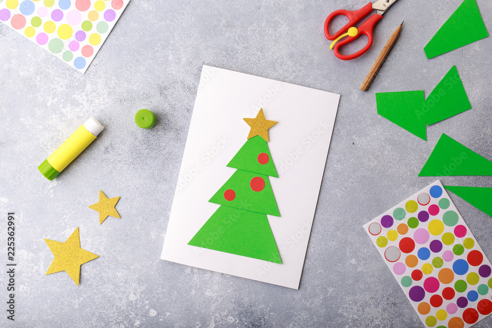 The child makes a greeting card Christmas paper collage. Made with his ...