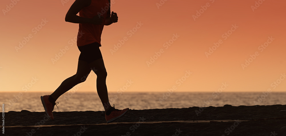 Silhouette of running man on sunset fiery sky background in sea Stock ...