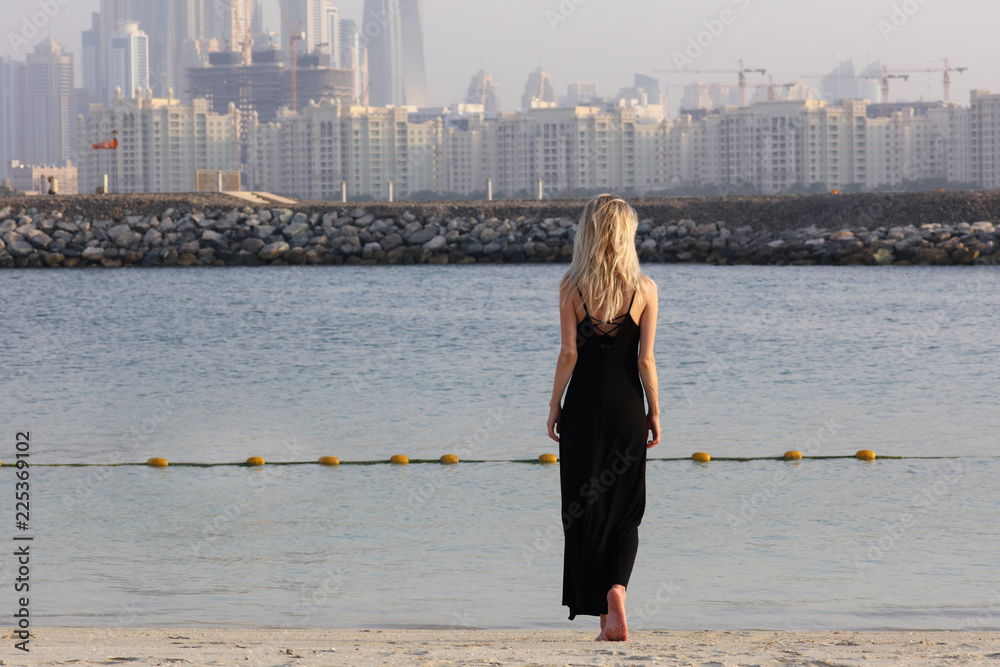 Dubai vacation expectation vs reality. Woman on the beach near ...