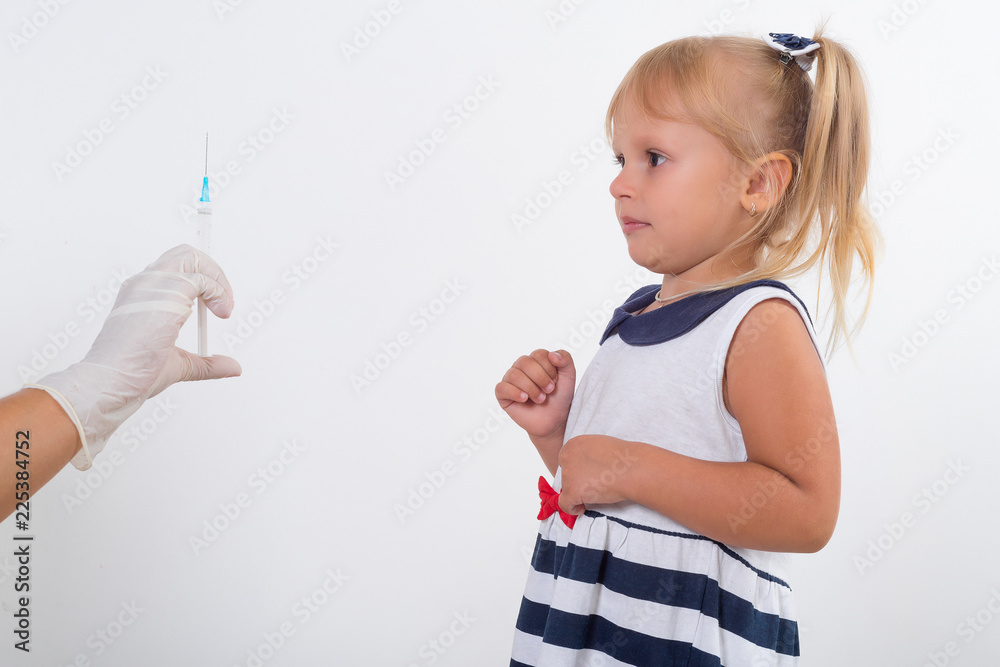 Doctor holds syringe to vaccinate sick baby with injection. Crying and ...