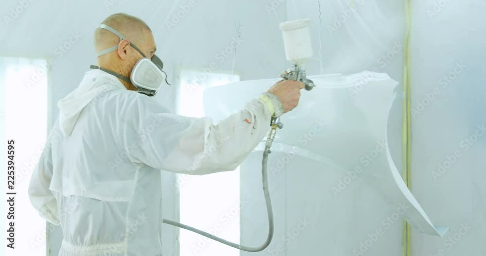 Mechanic painting car parts with electric spray gun 4k Stock Video ...