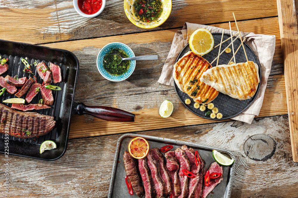 Dinner table Beef chicken grilled meat Outdoors food top view Stock ...