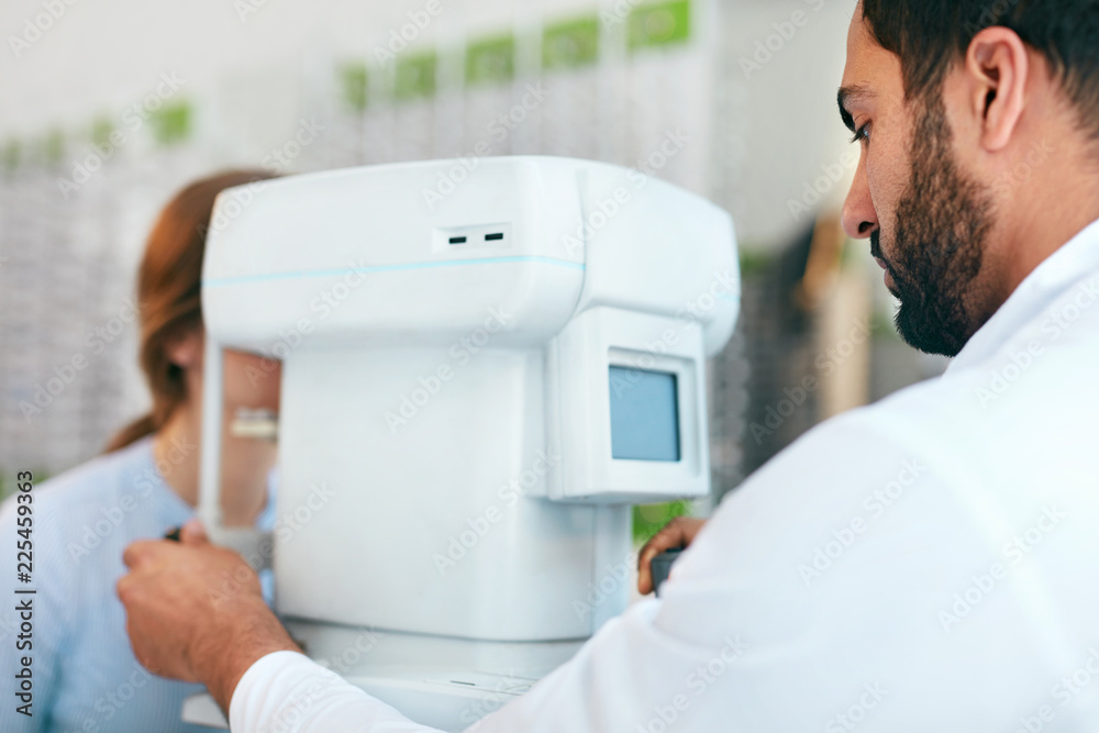 Eye Test. Optometrist Testing Woman Eyesight On Modern Equipment Stock ...