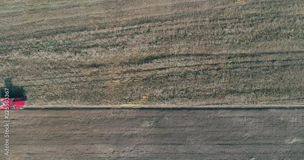 Countryside and agriculture, grain sowing, farm tractors plow the earth ...