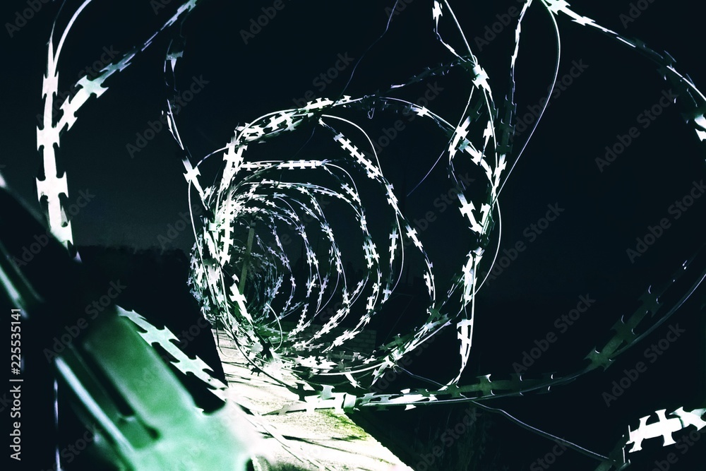 Barbed wire steel wall against the immigations in europe. Barbed wire ...