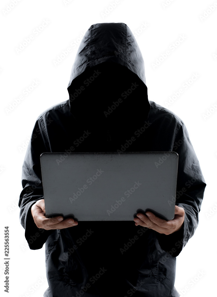 Hacker with hidden face in a hoodie using a laptop isolated on white ...