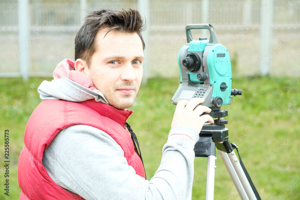 Civil engineer land survey with tacheometer or theodolite equipment ...