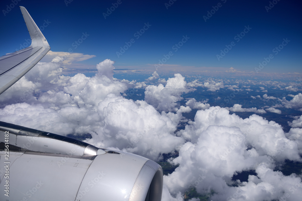 Boeing 737 MAX airplane, view of jet engine, wing, and the earth's ...