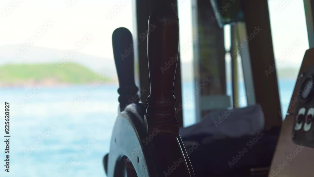 Steering wheel of sailing ship in captain bridge close up. Ship wheeel ...