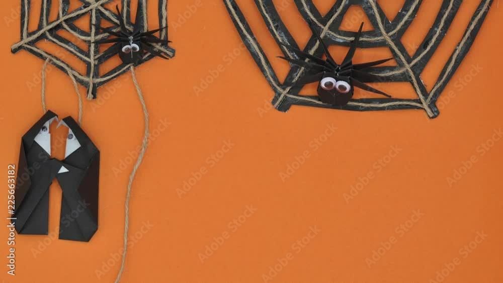 Origami (Paper Folding) that 2 spiders on cobwebs pulling the nun ...