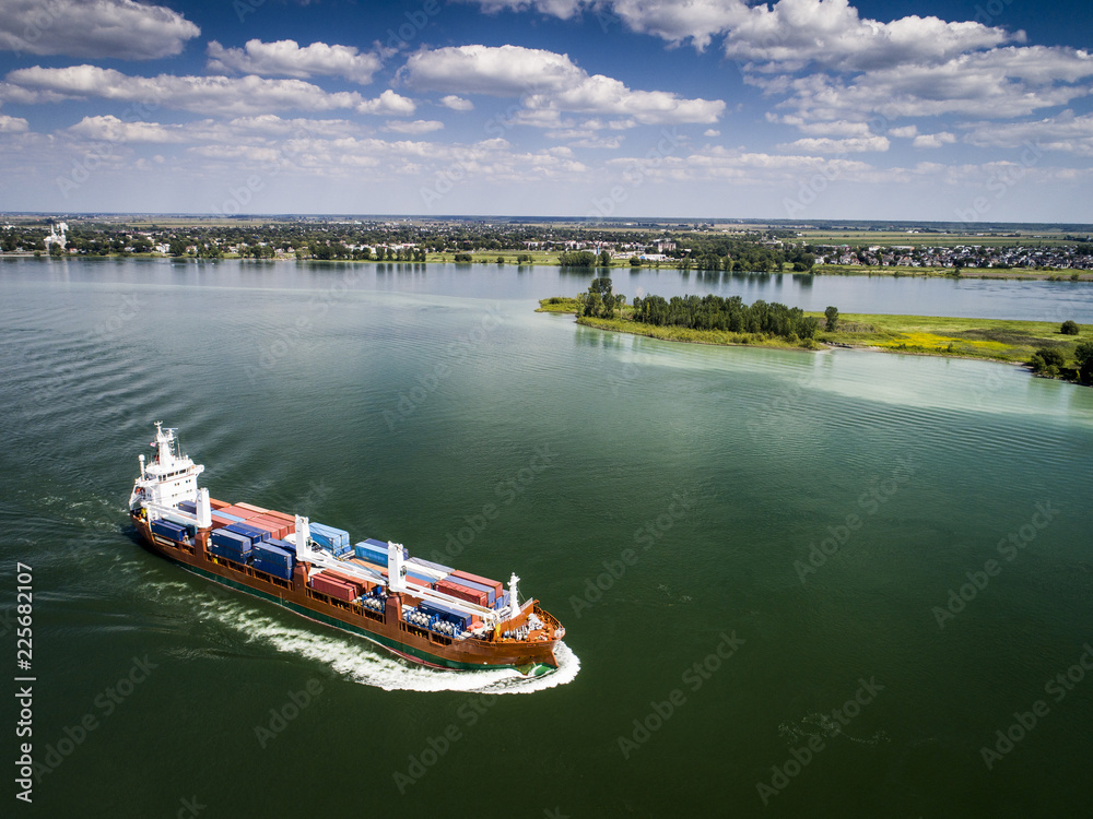 Fully loaded cargo ship approaching Montreal Port on the St-Lawrence ...