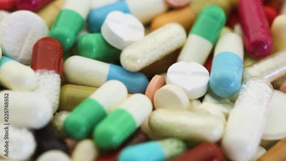 Closeup pan shot of colorful medication pills Stock Video | Adobe Stock