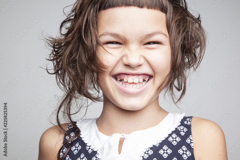 Portrait of a girl with a stylish hairstyle with a short bangs and nice ...