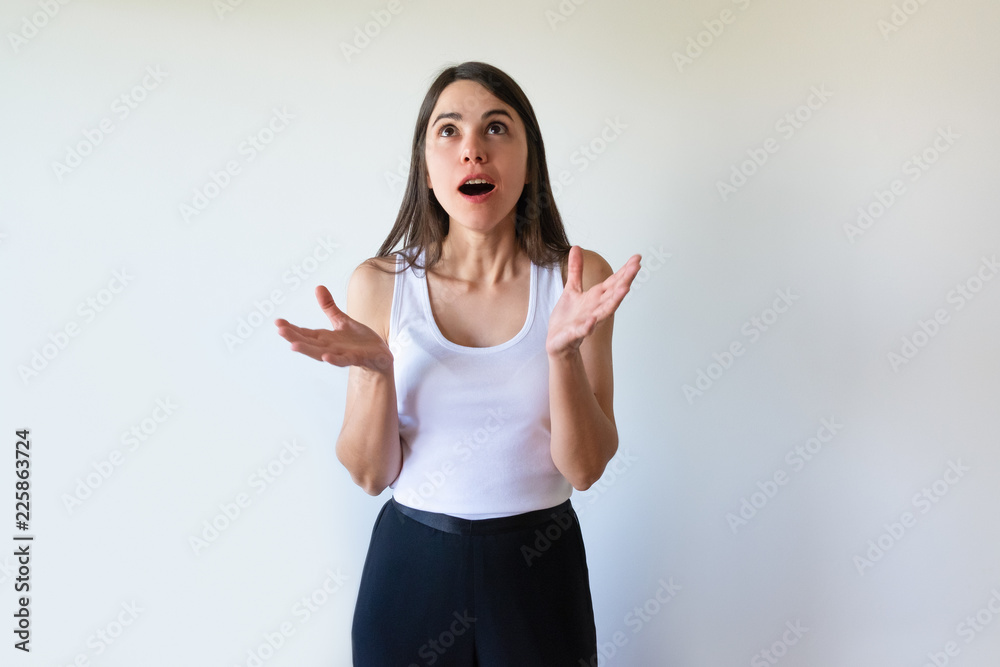 Shocked emotional lady looking up and gesturing hands. Surprised ...