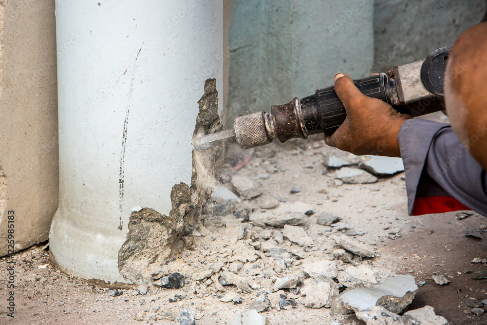 Man drilling the pile with Impact drill / Worker using impact drill ...
