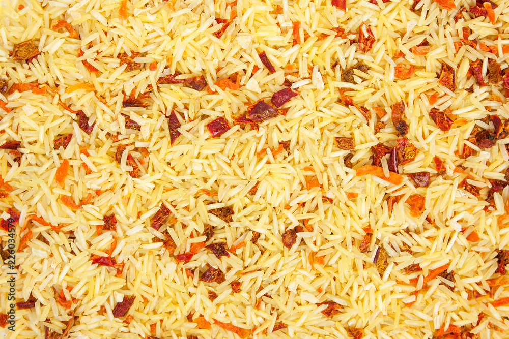 Background texture of basmati rice with dried vegetables. Top view ...